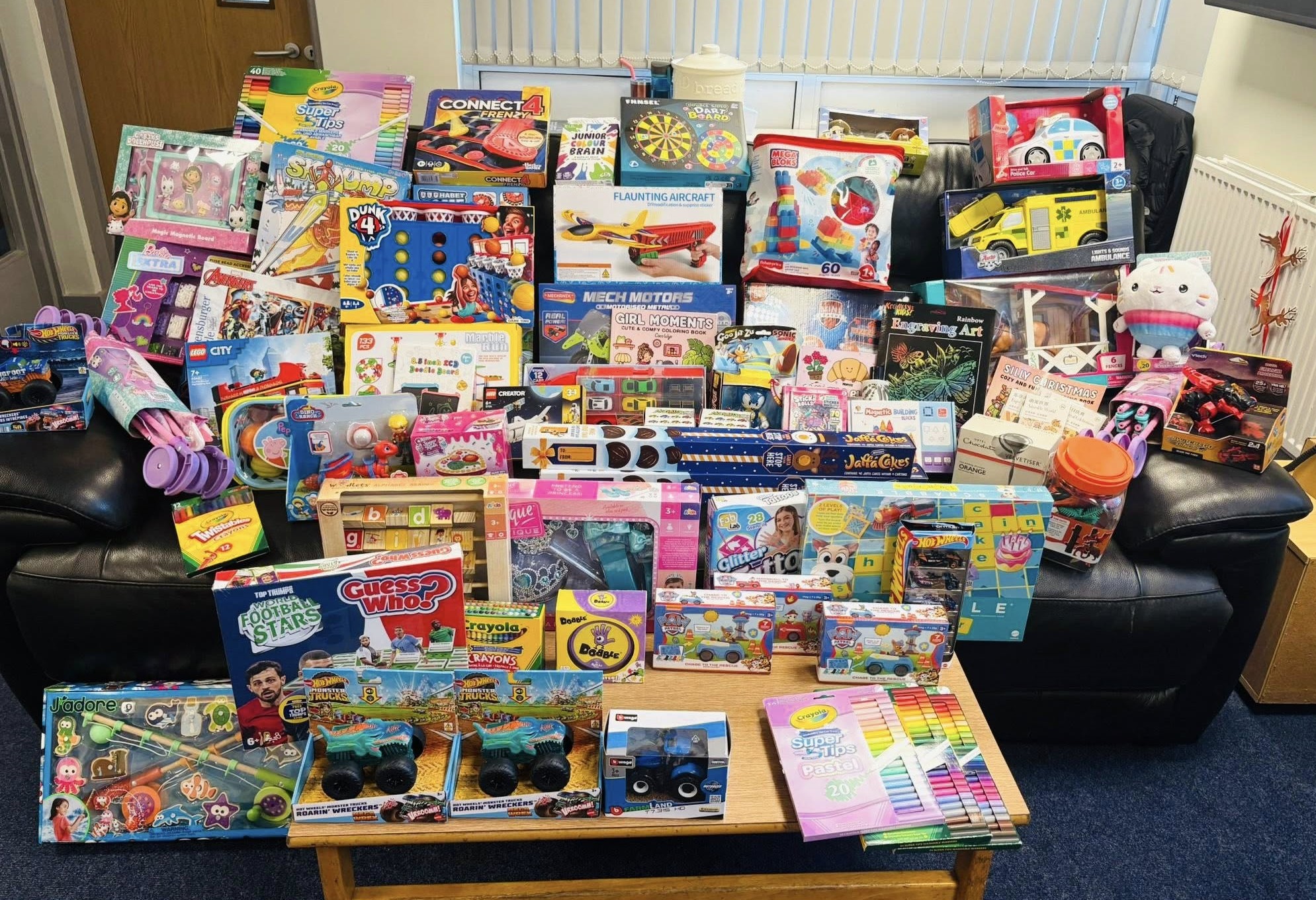 Surrey colleagues collect festive gift donations for Shooting Star ...